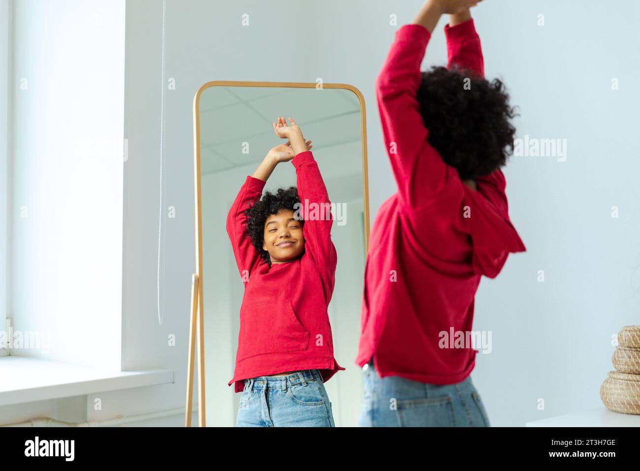 Love yourself. Beautiful young smiling african american woman dancing ...