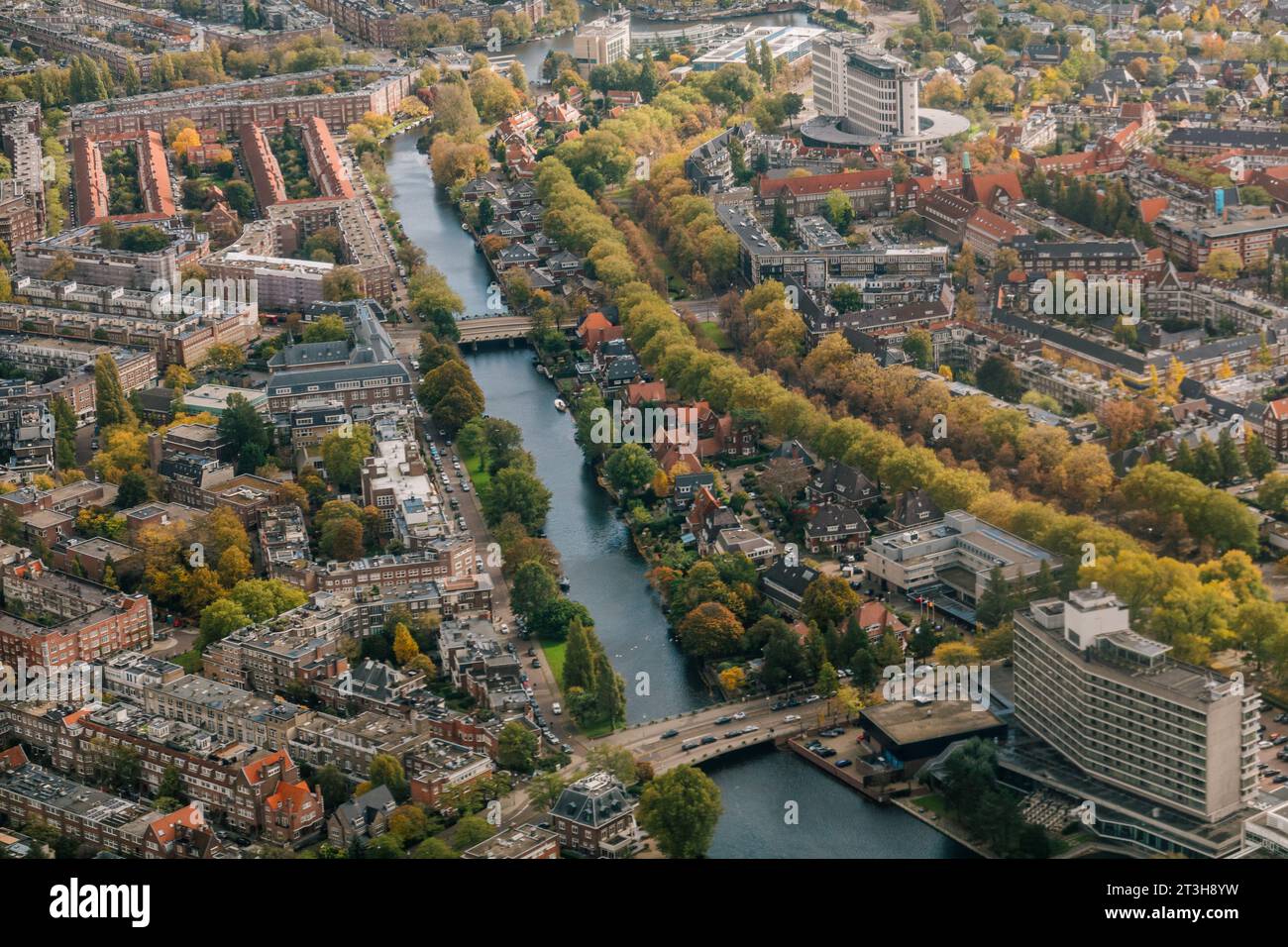 an aerial view of a canal flowing through Amsterdam, Netherlands, on an ...