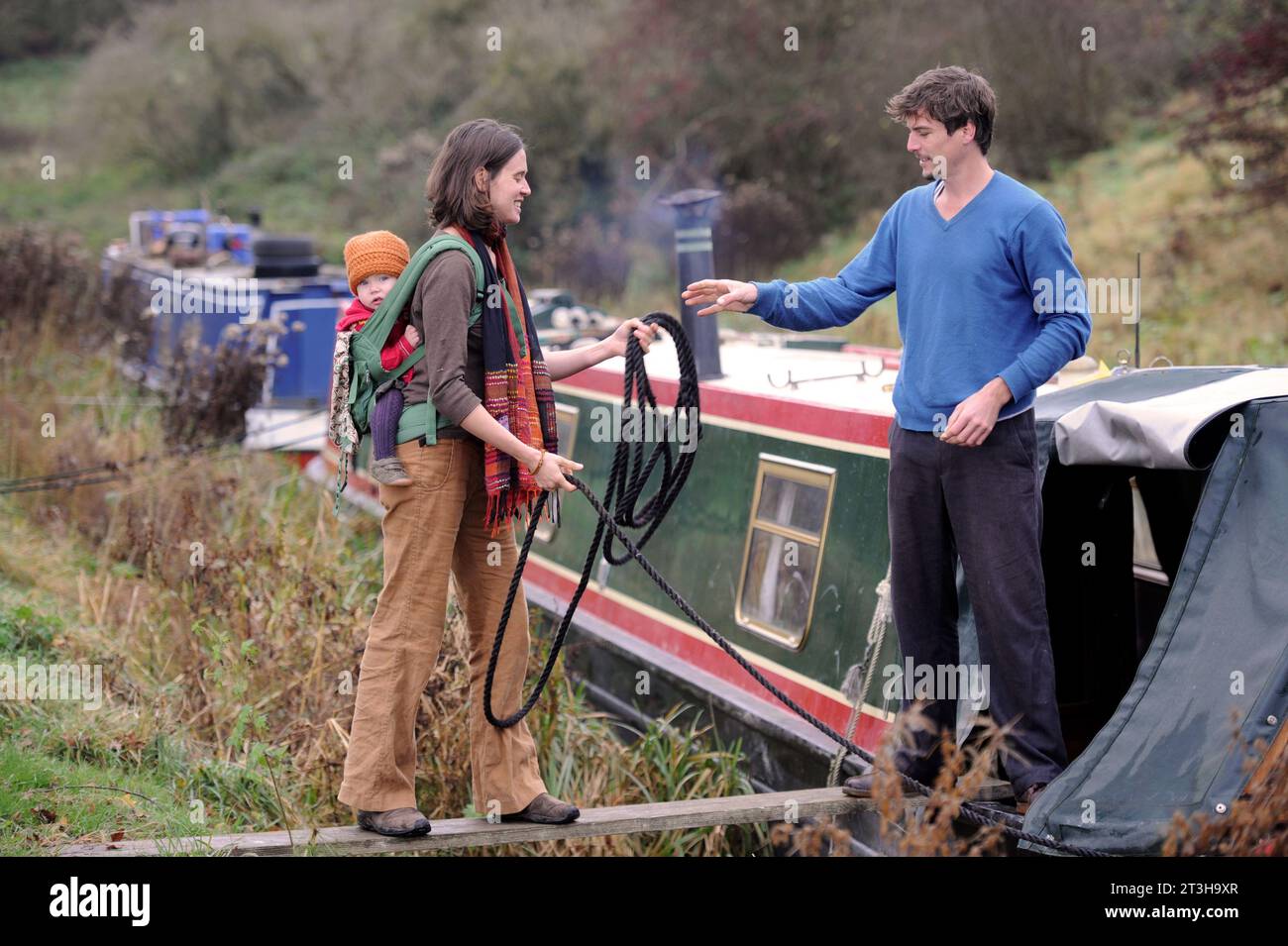 A young couple living on a barge on the Kennet and Avon canal near ...