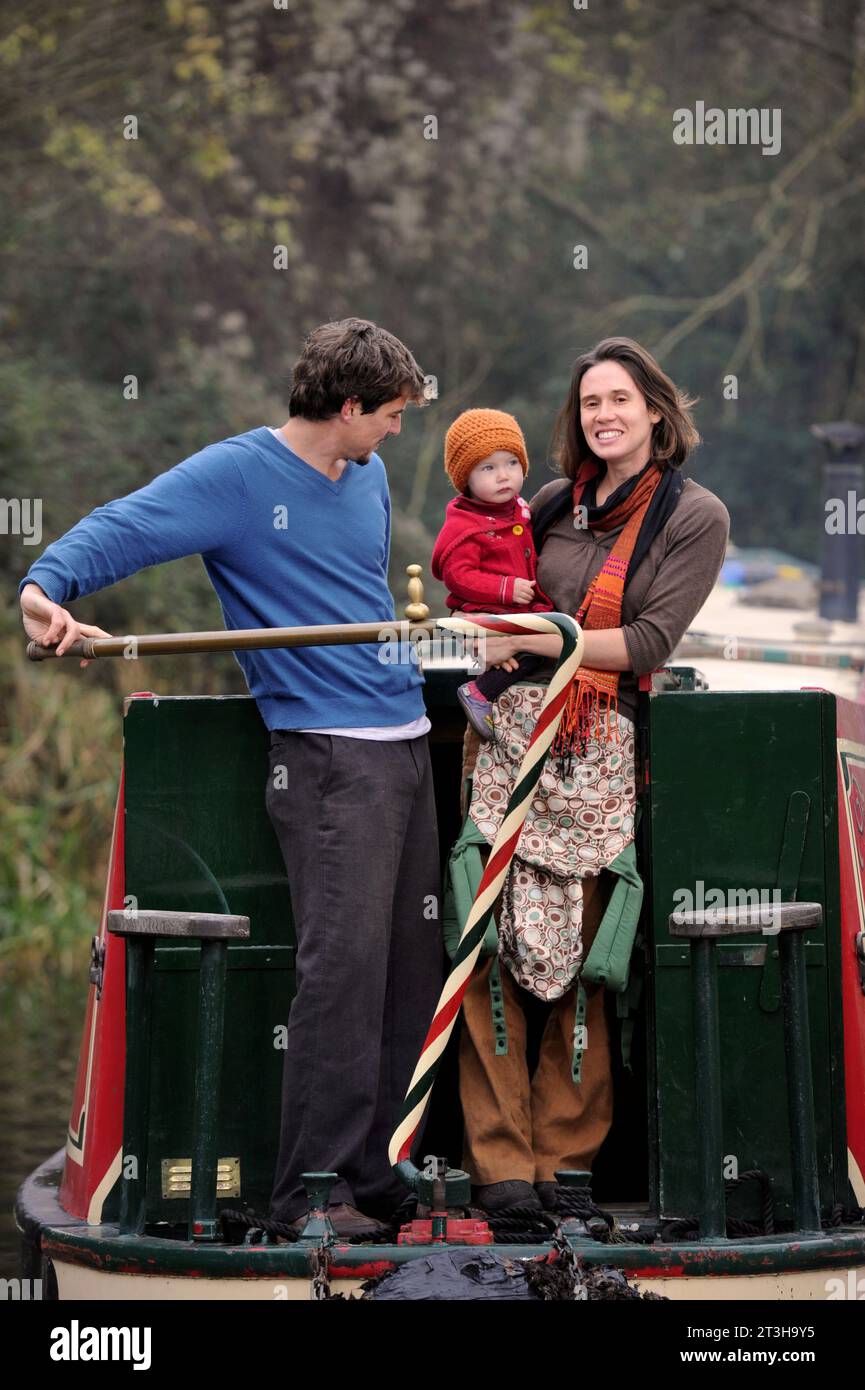 A young couple living on a barge on the Kennet and Avon canal near ...
