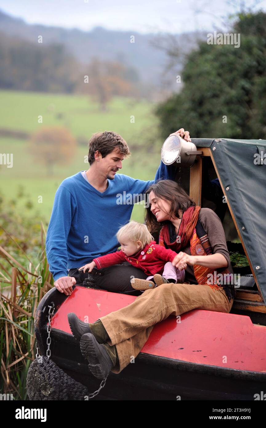 A young couple living on a barge on the Kennet and Avon canal near ...