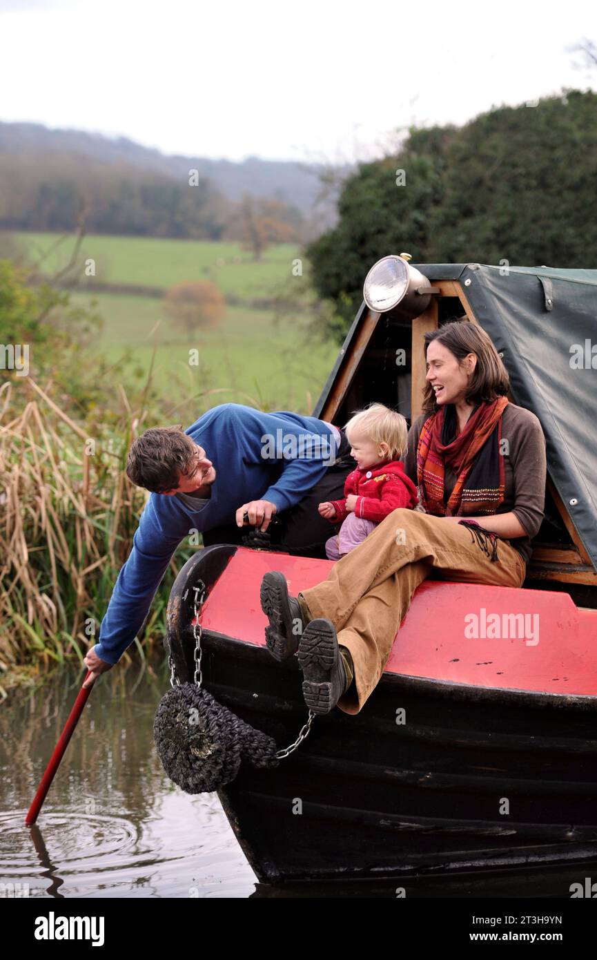 A young couple living on a barge on the Kennet and Avon canal near ...