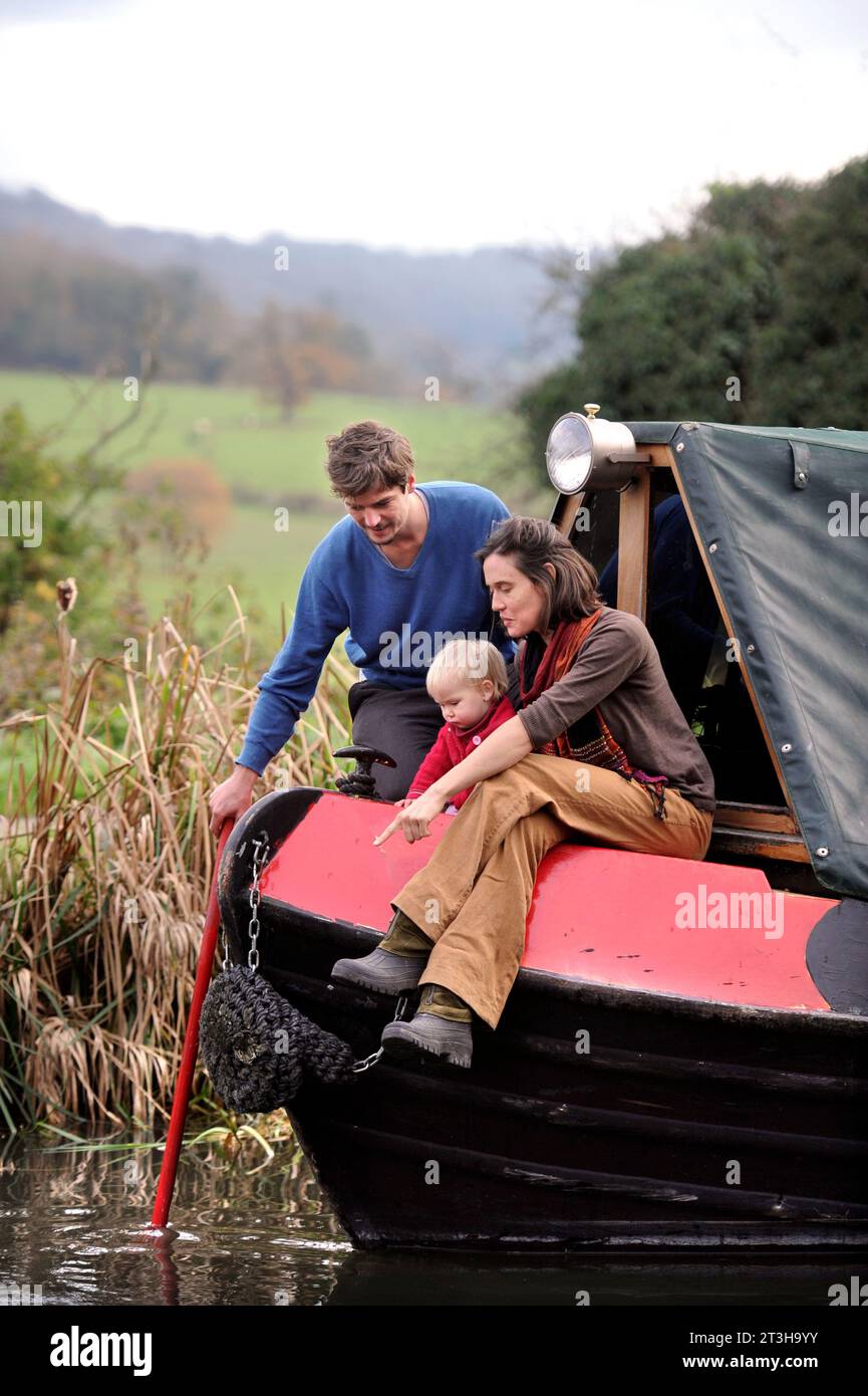 A young couple living on a barge on the Kennet and Avon canal near ...