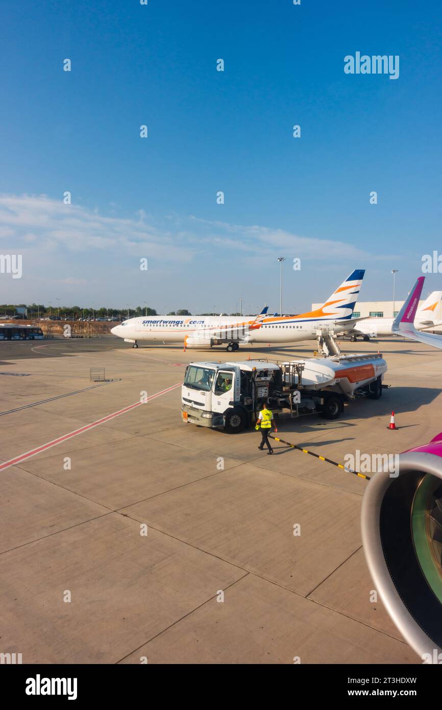 Aircraft refuelling tanker on the apron from Wizzair window. Czech ...
