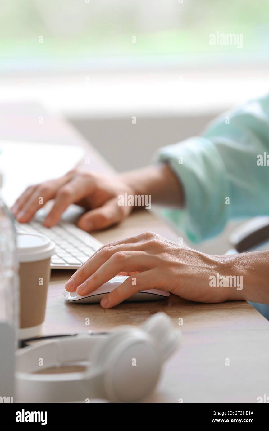 Male programmer working with computer at table in office, closeup Stock ...