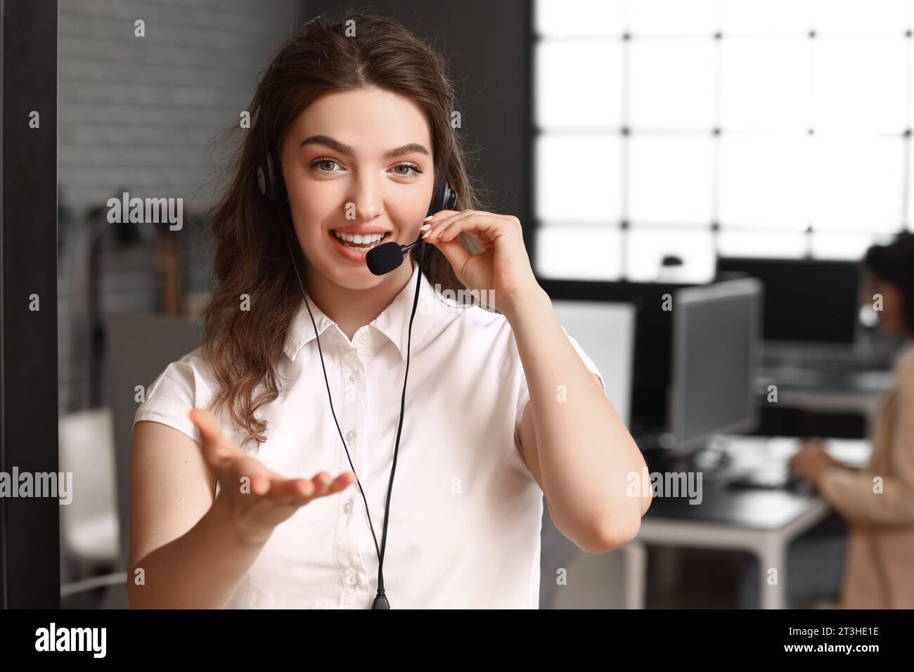 Female technical support agent in office Stock Photo - Alamy