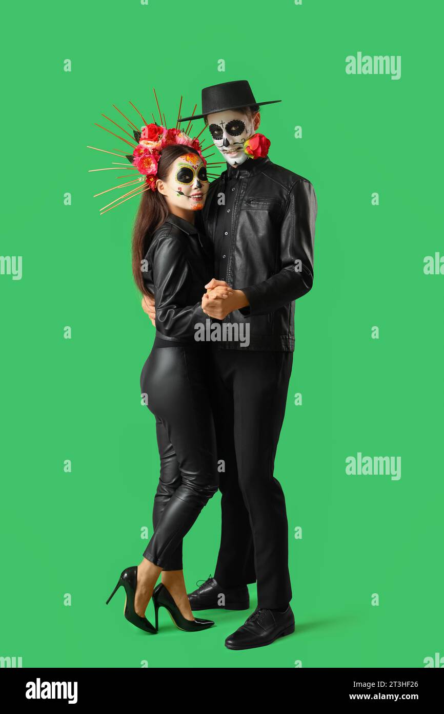 Young couple dressed for Mexico's Day of the Dead (El Dia de Muertos ...