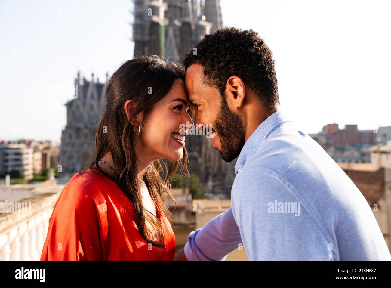 Multiracial beautiful happy couple of lovers dating on rooftop balcony ...