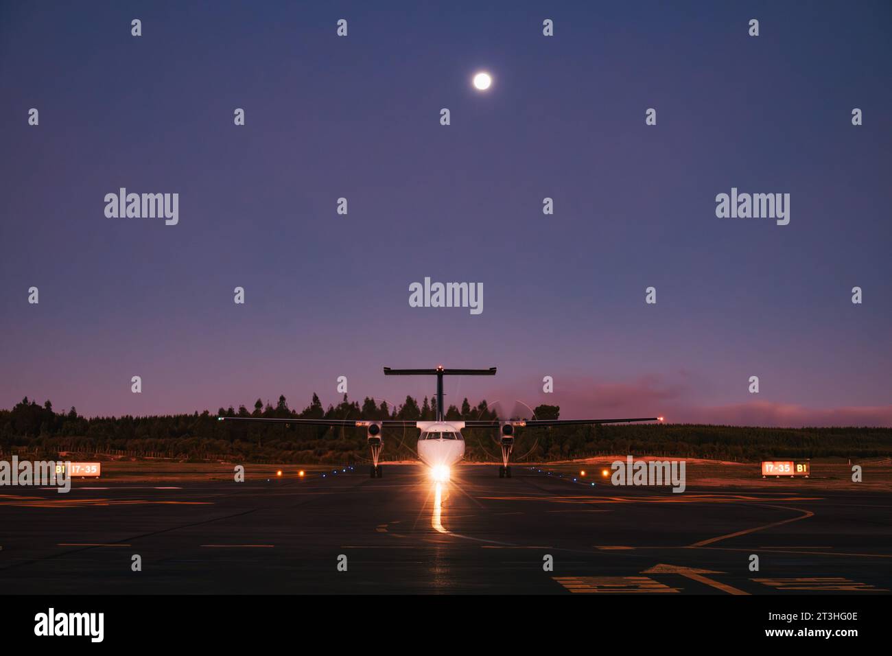 an Air New Zealand Q300 'Dash 8' turboprop aircraft comes in to park at ...