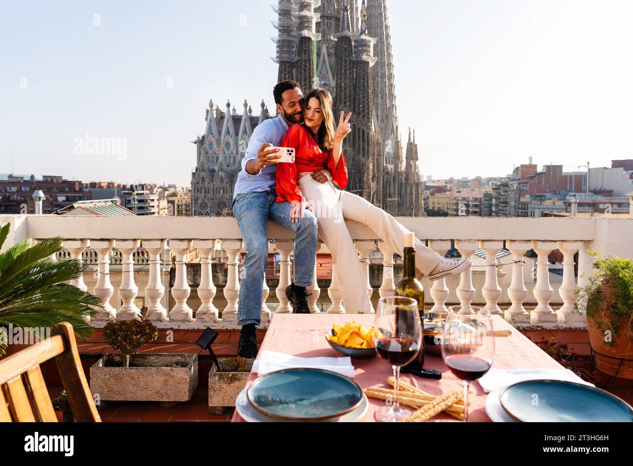 Multiracial beautiful happy couple of lovers dating on rooftop balcony ...