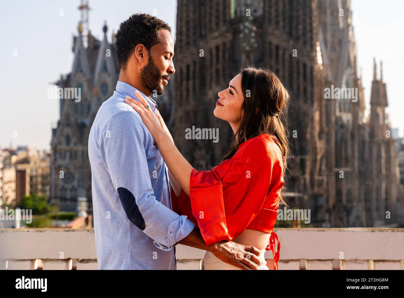 Multiracial beautiful happy couple of lovers dating on rooftop balcony ...