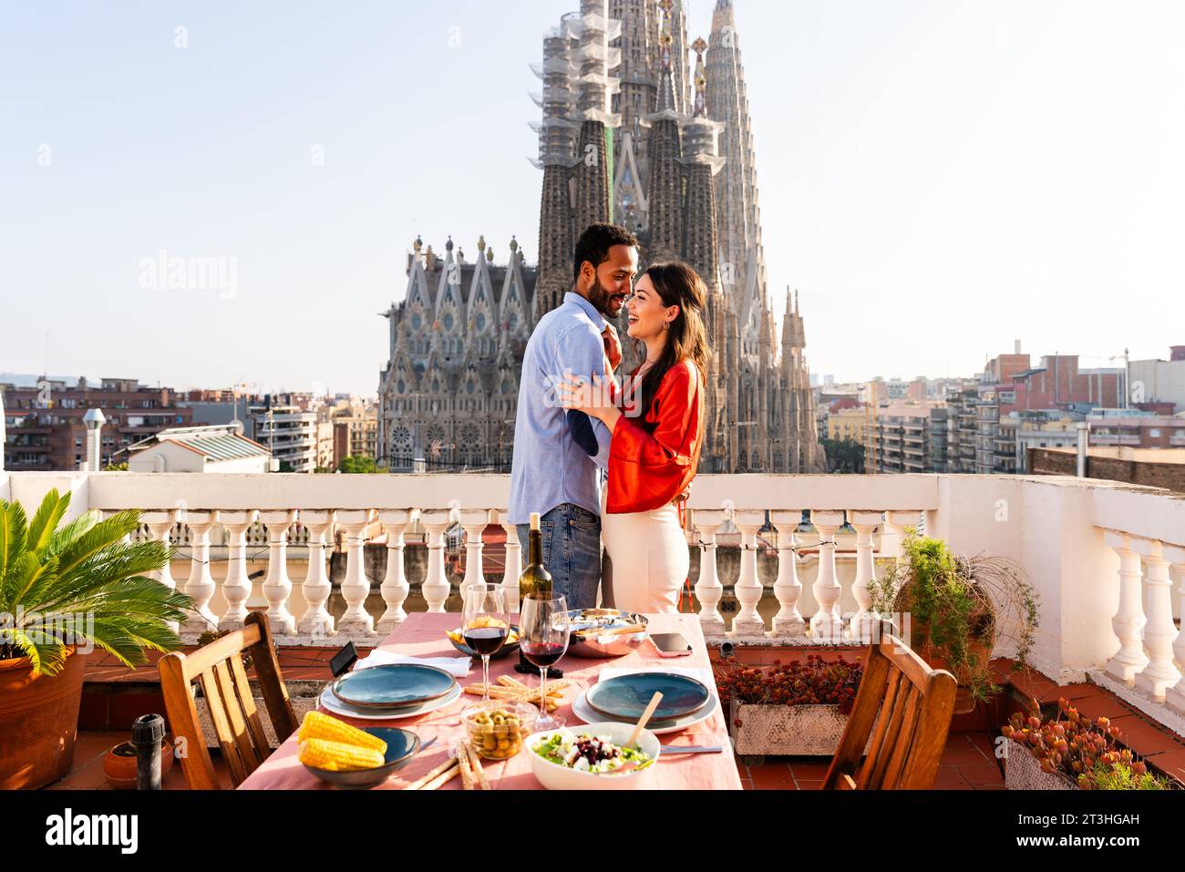 Multiracial beautiful happy couple of lovers dating on rooftop balcony ...