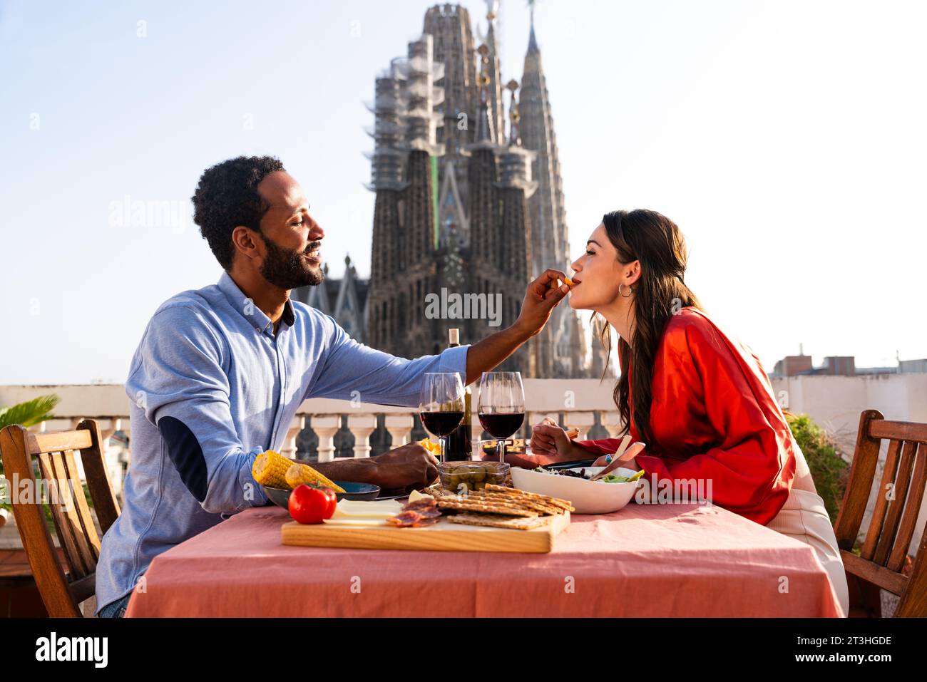 Multiracial beautiful happy couple of lovers dating on rooftop balcony ...