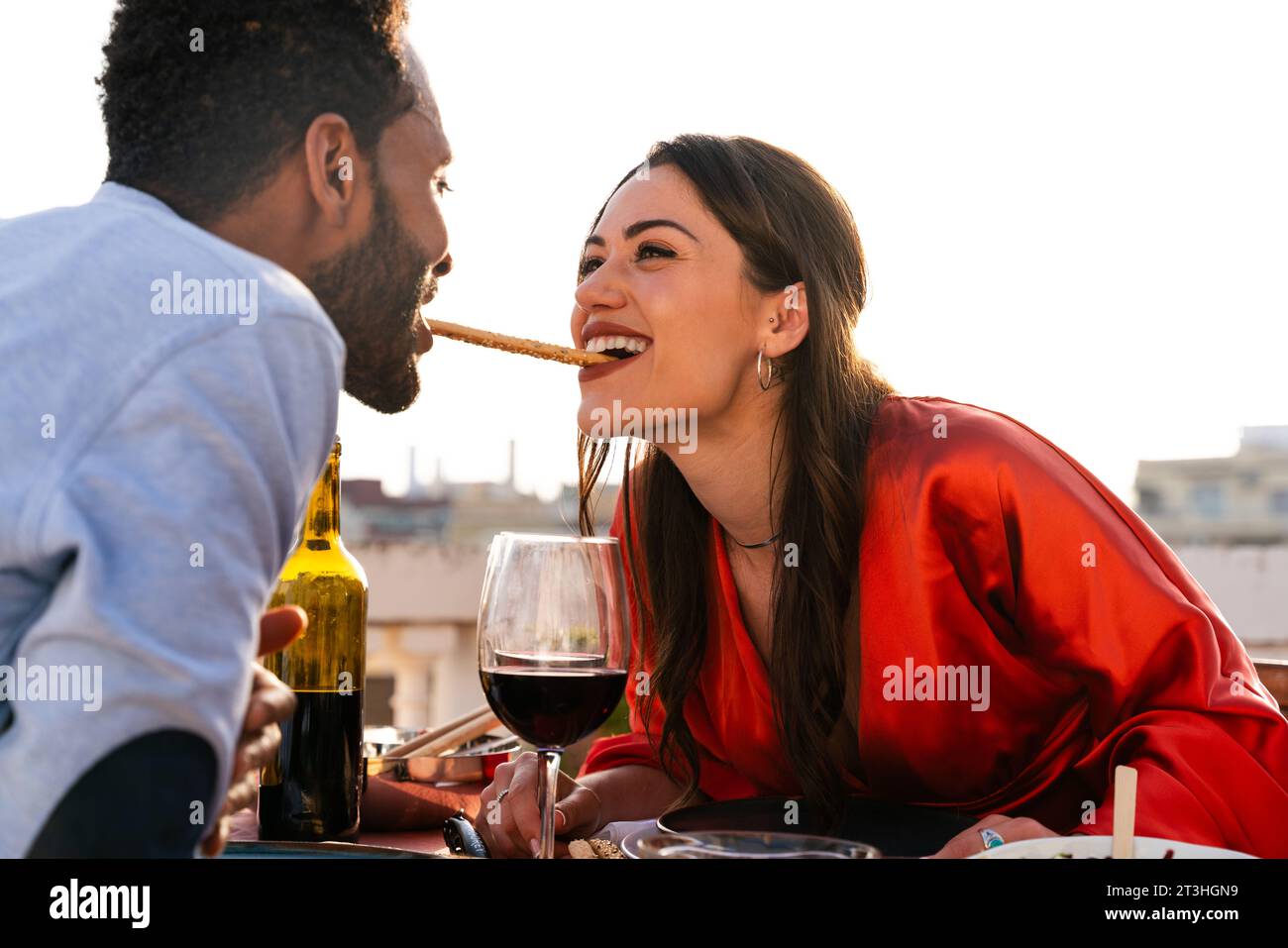Multiracial beautiful happy couple of lovers dating on rooftop balcony ...
