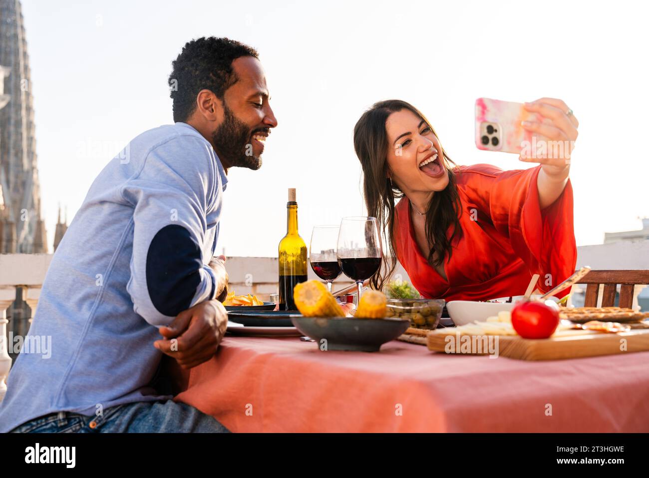 Multiracial beautiful happy couple of lovers dating on rooftop balcony ...