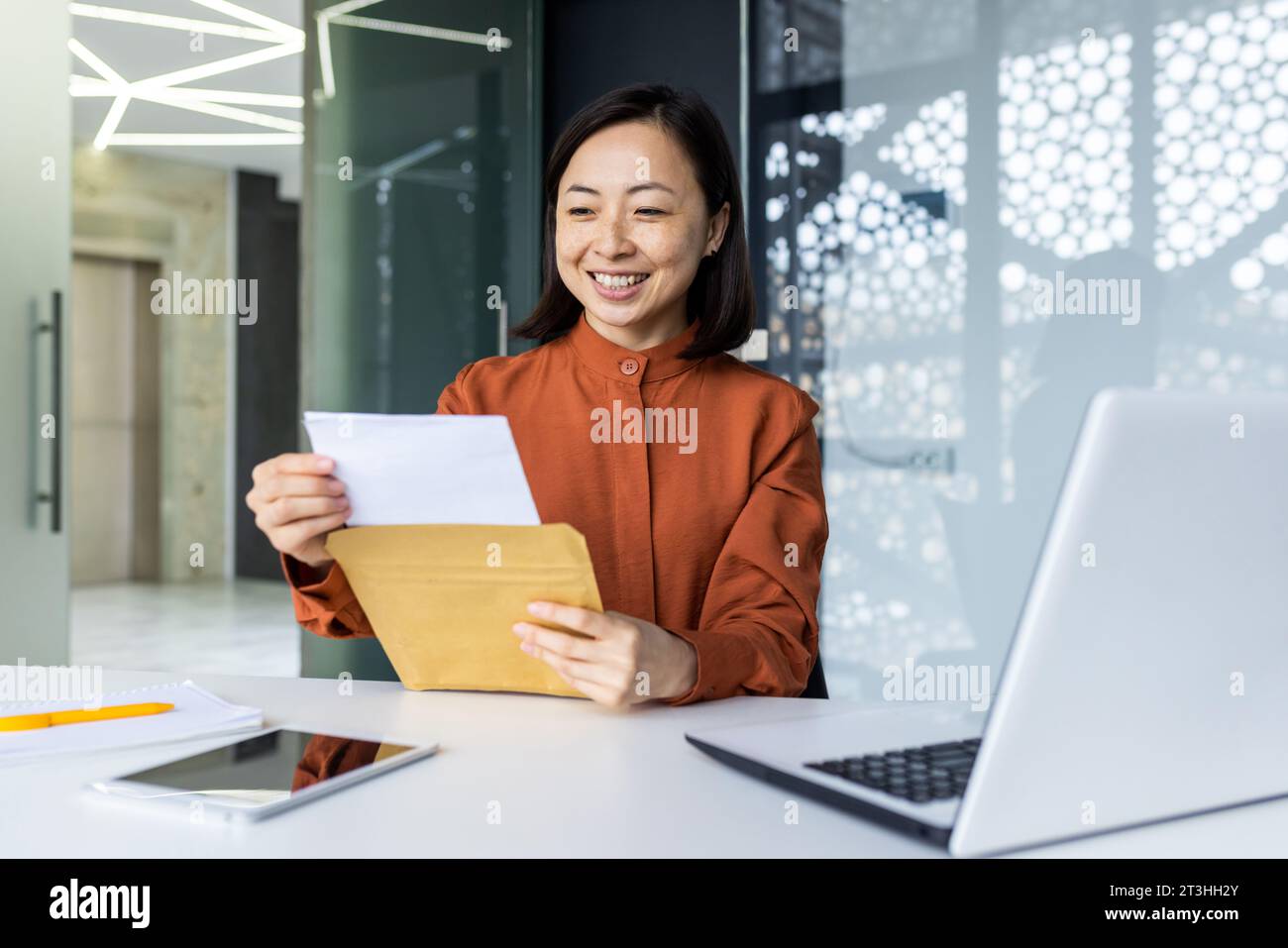 Successful satisfied business woman received mail envelope letter with ...