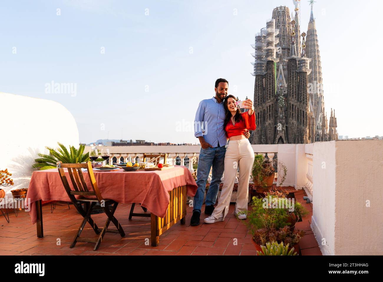Multiracial beautiful happy couple of lovers dating on rooftop balcony ...