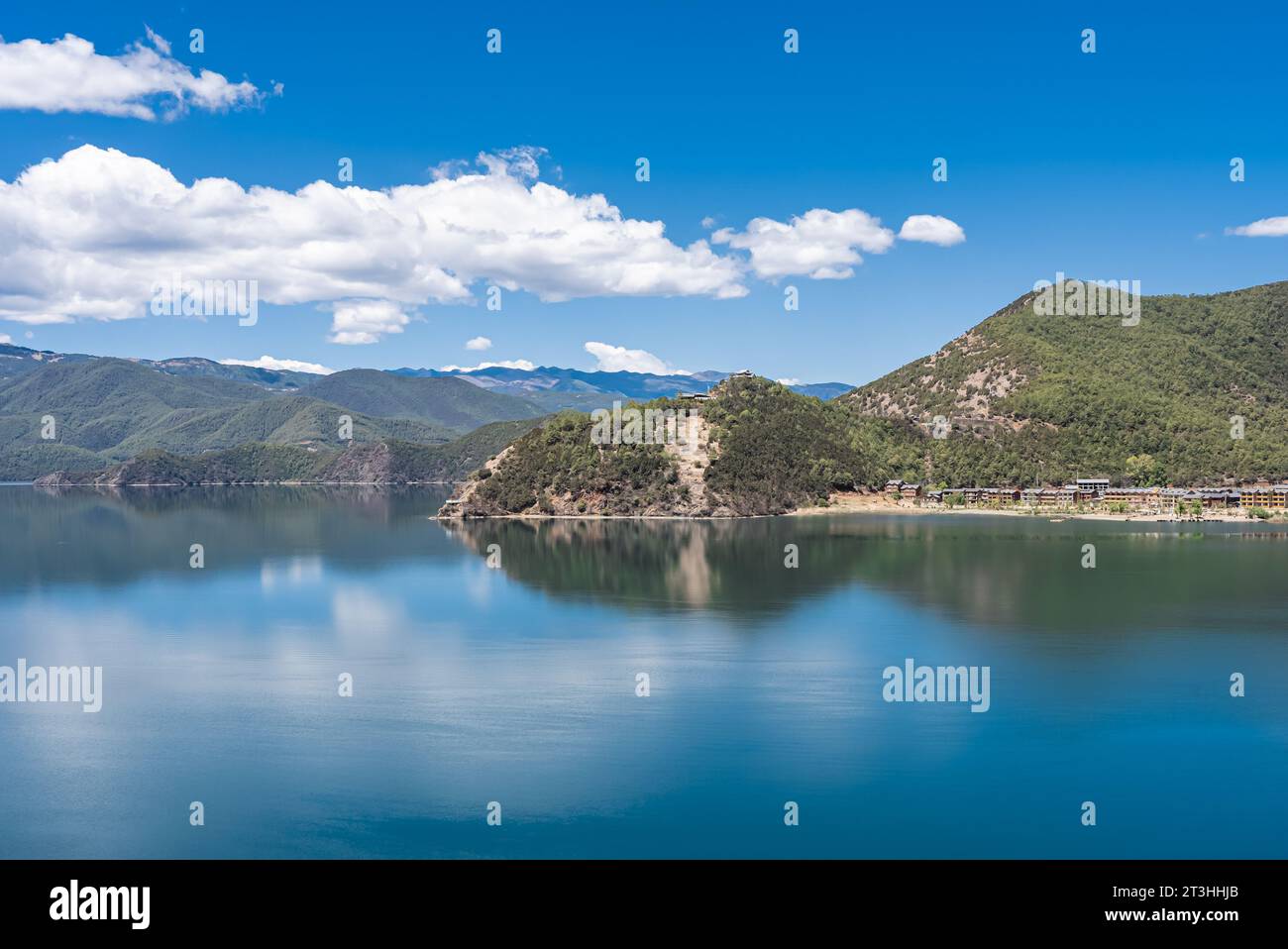 The reflection of blue sky and white clouds on the water surface of ...