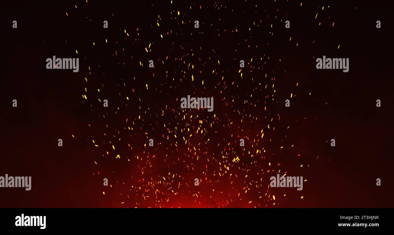 Slowly flying upward sparks from the fire. Orange sparks on a red ...