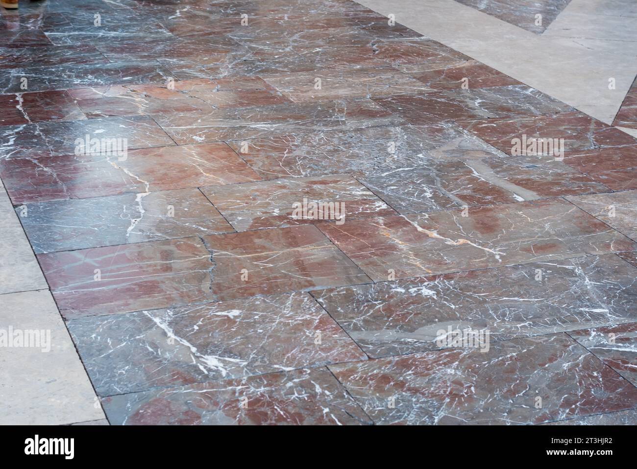 Valencia, Spain - September 22th, 2023. Red Square marble floor. The ...
