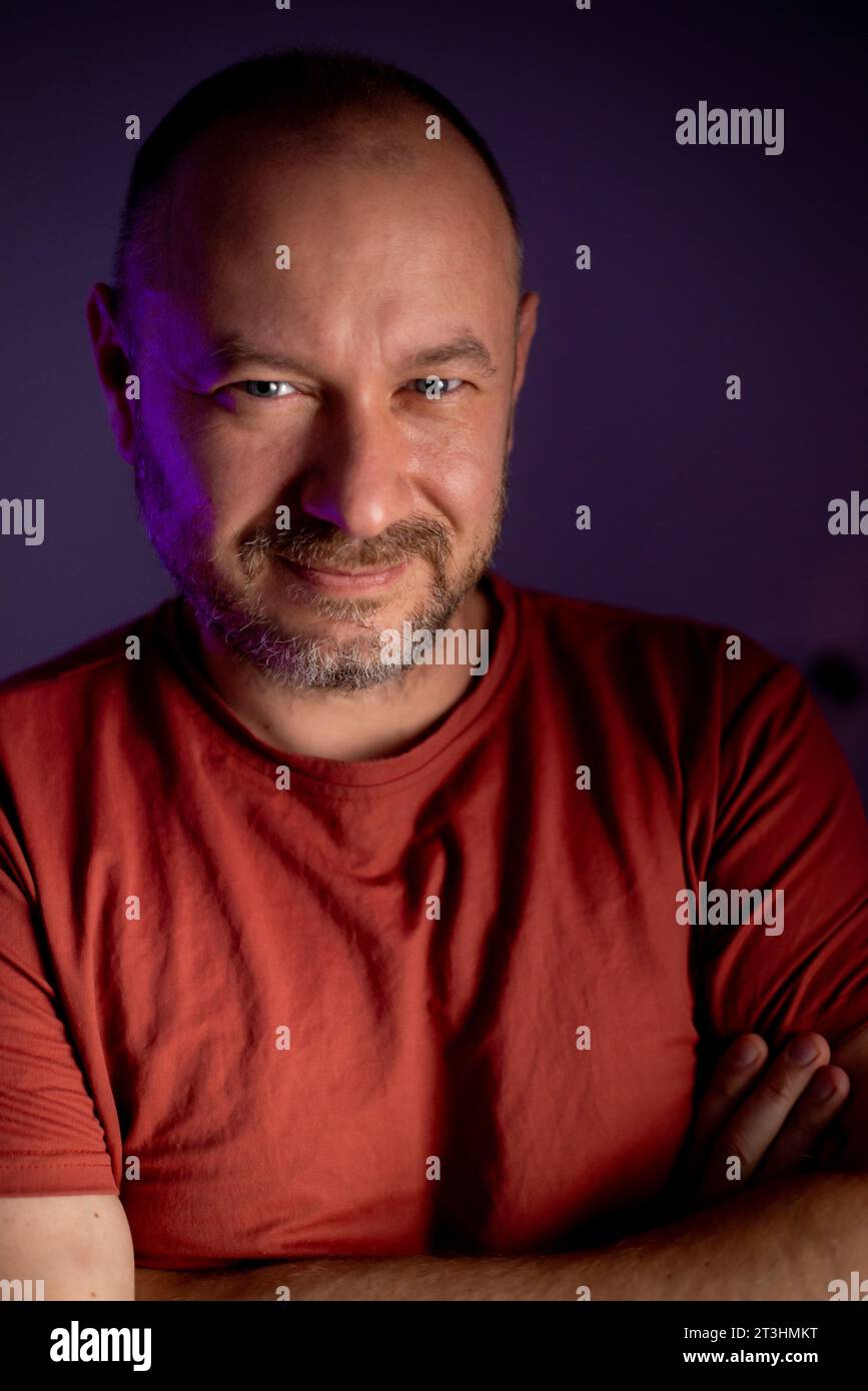 Close-up portrait of a middle-aged, unshaven man with an approachable ...