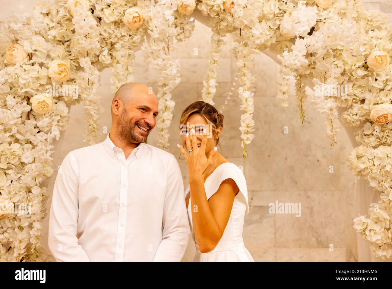 Happy young smiling couple in the marriage registration hall. The ...
