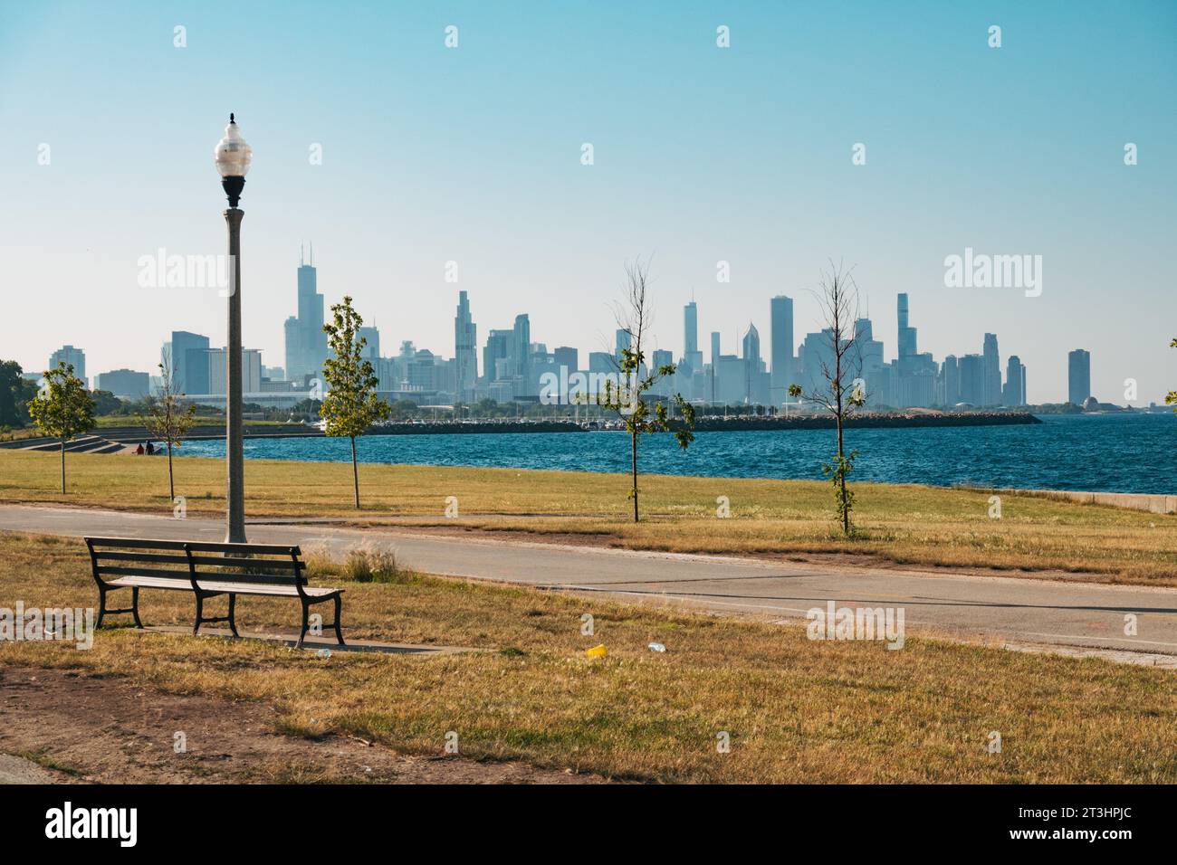 a park bench and lamppost at Burnham Park on the shores of Lake ...