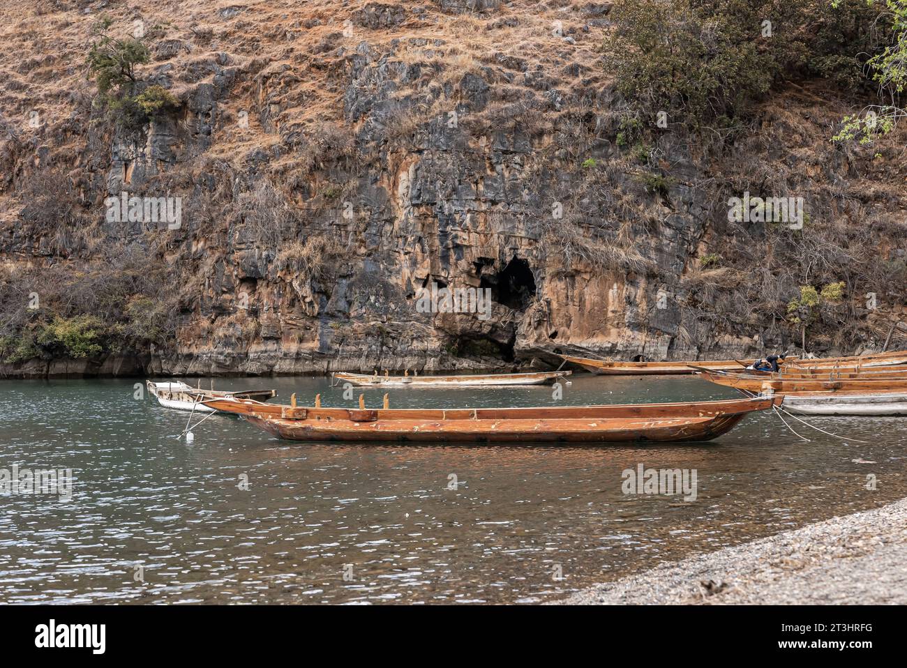 Pig trough boats on the surface of Lugu Lake in China Stock Photo - Alamy