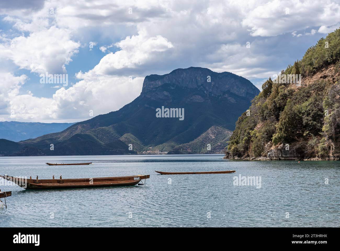Pig trough boats on the surface of Lugu Lake in China Stock Photo - Alamy