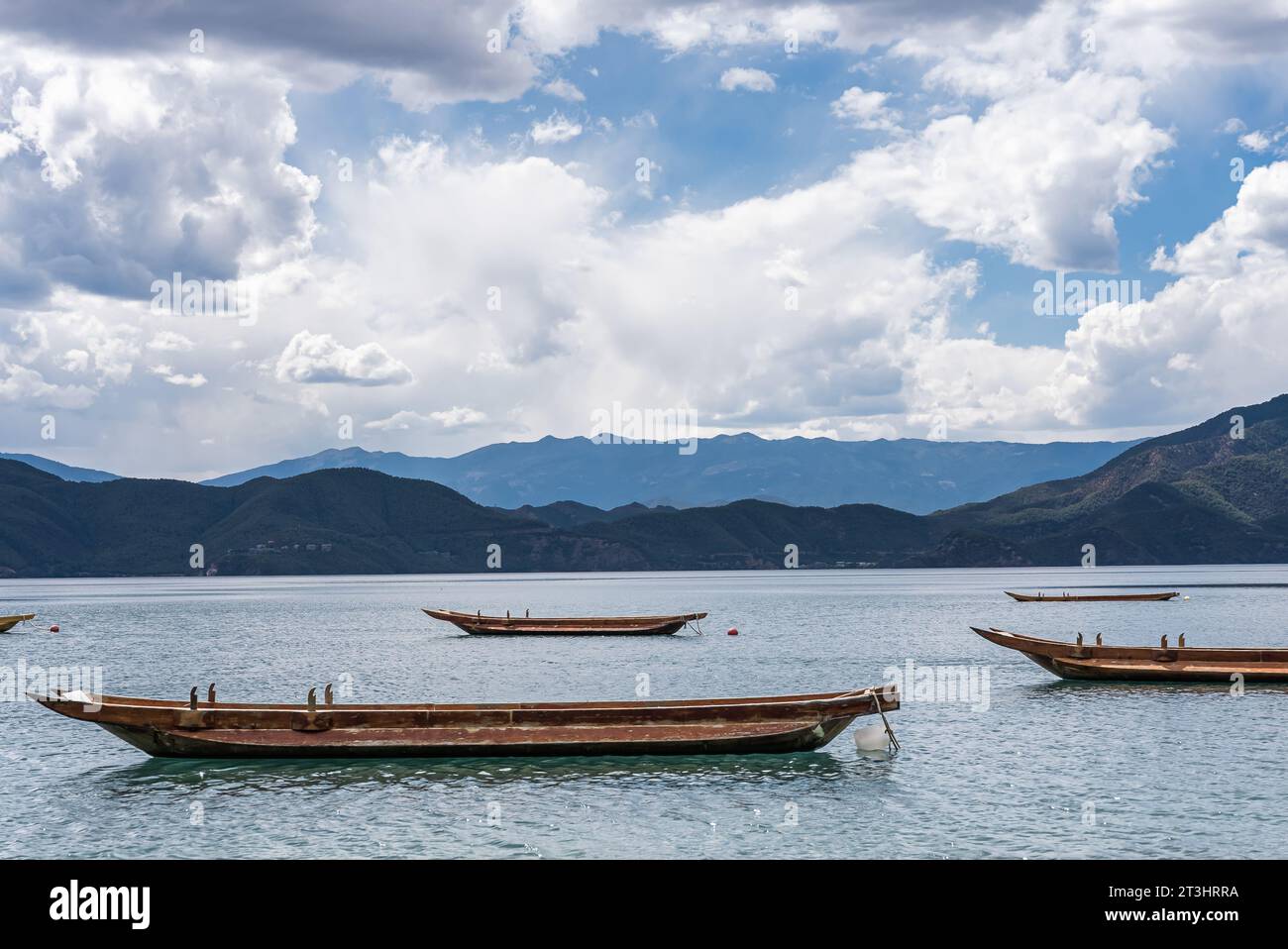 Pig trough boats on the surface of Lugu Lake in China Stock Photo - Alamy