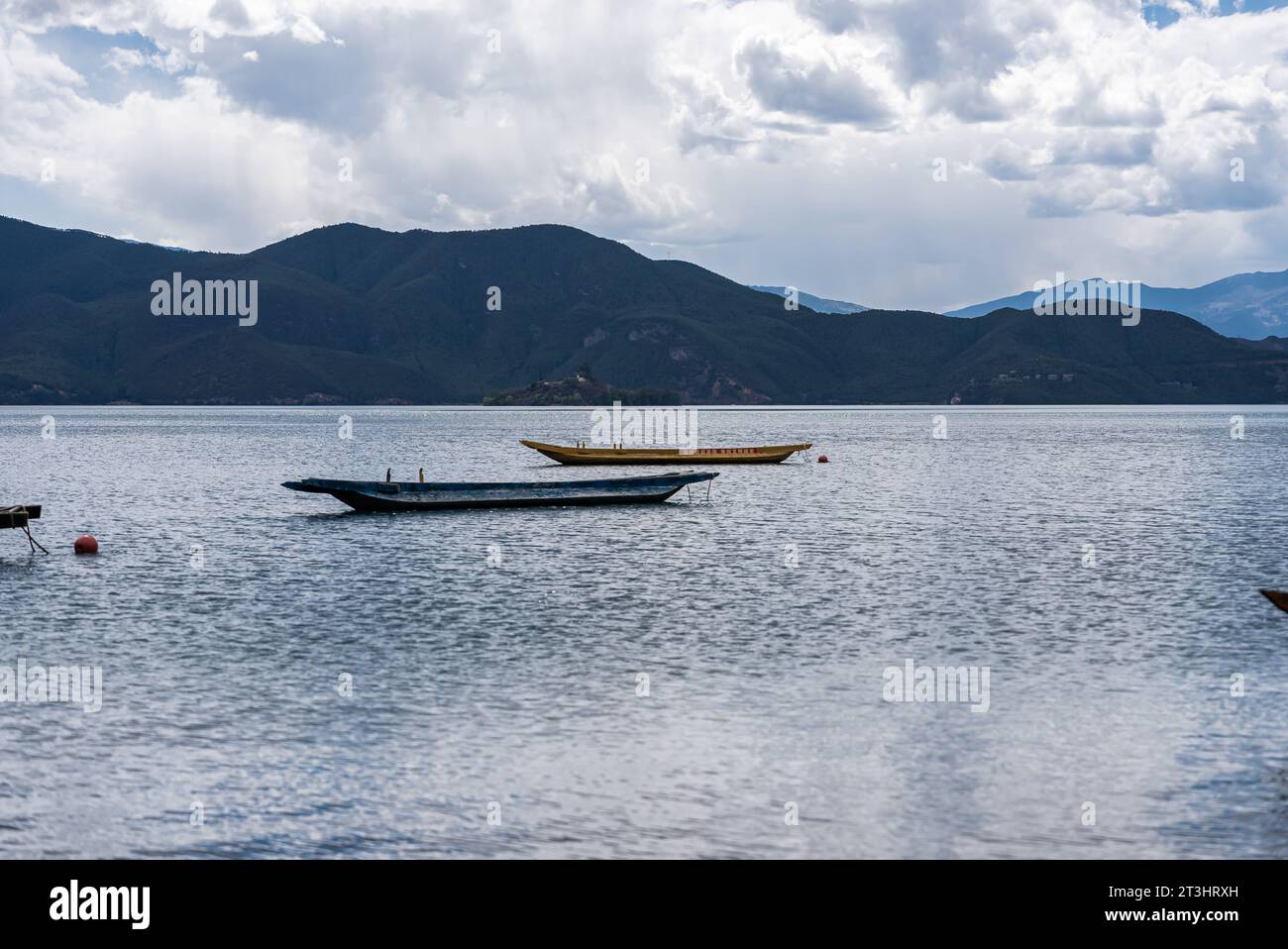 Pig trough boats on the surface of Lugu Lake in China Stock Photo - Alamy