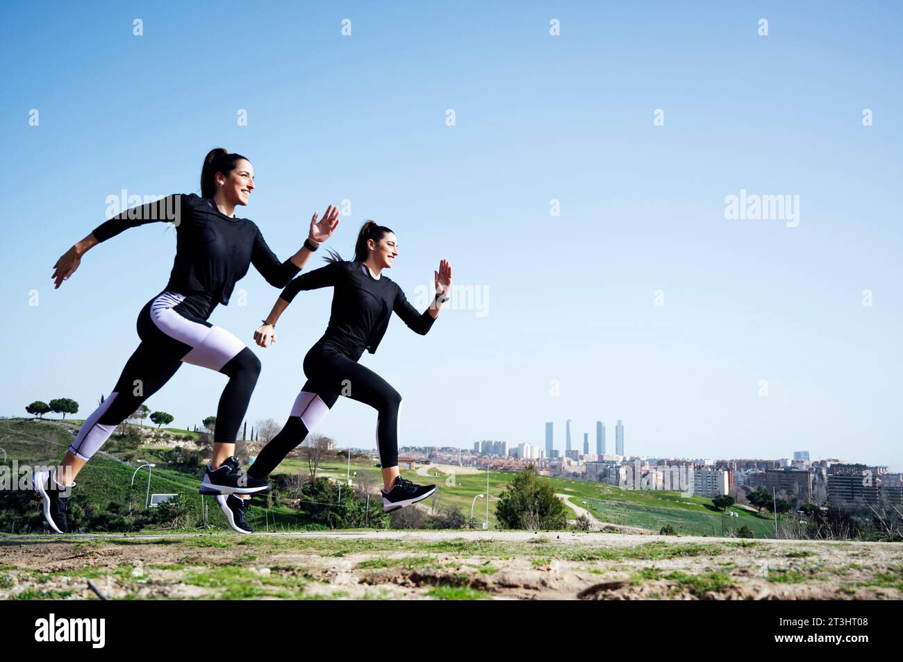 two women running side view Stock Photo - Alamy