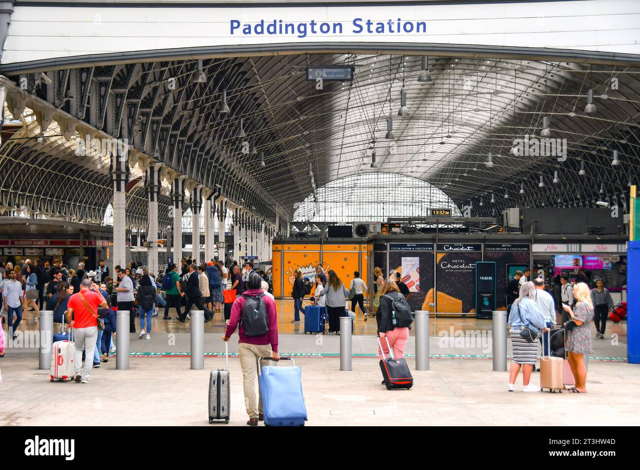 London, England, UK - 28 June 2023: Person with suitcases walking into ...