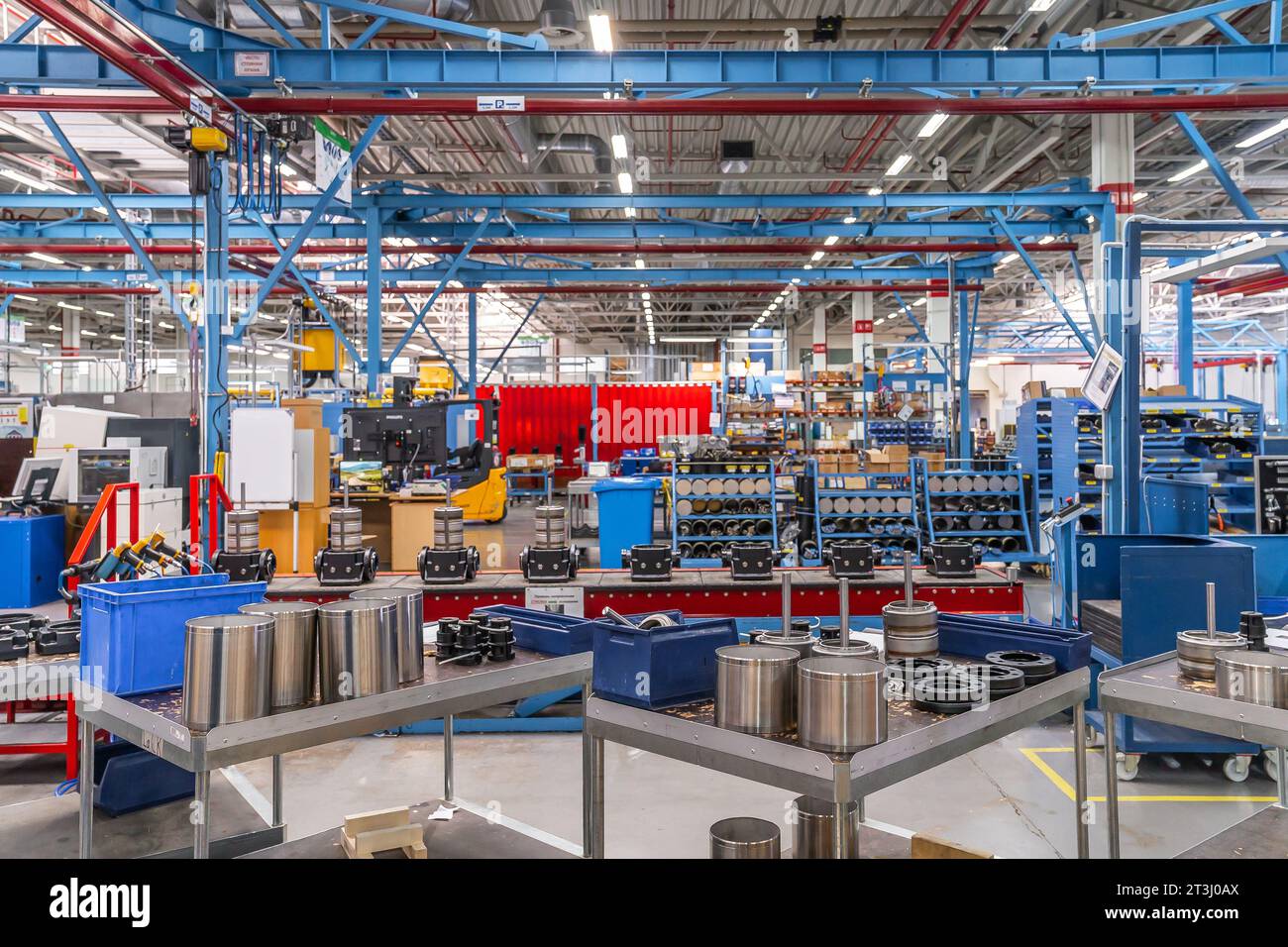 Factory warehouse with stacks of products front view of interior. High ...