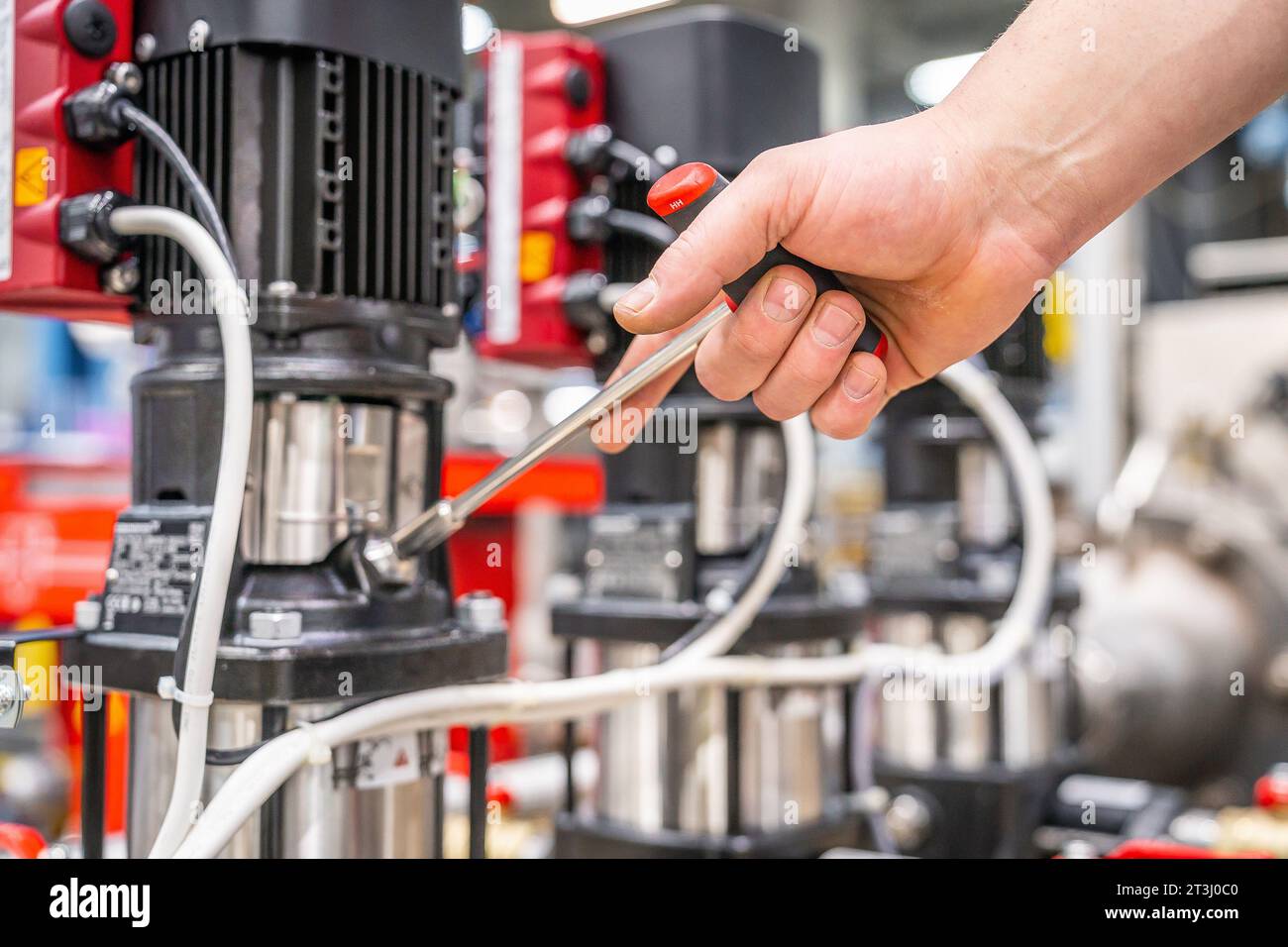 Montage Engineer Testing equipment with right hand no face. High ...