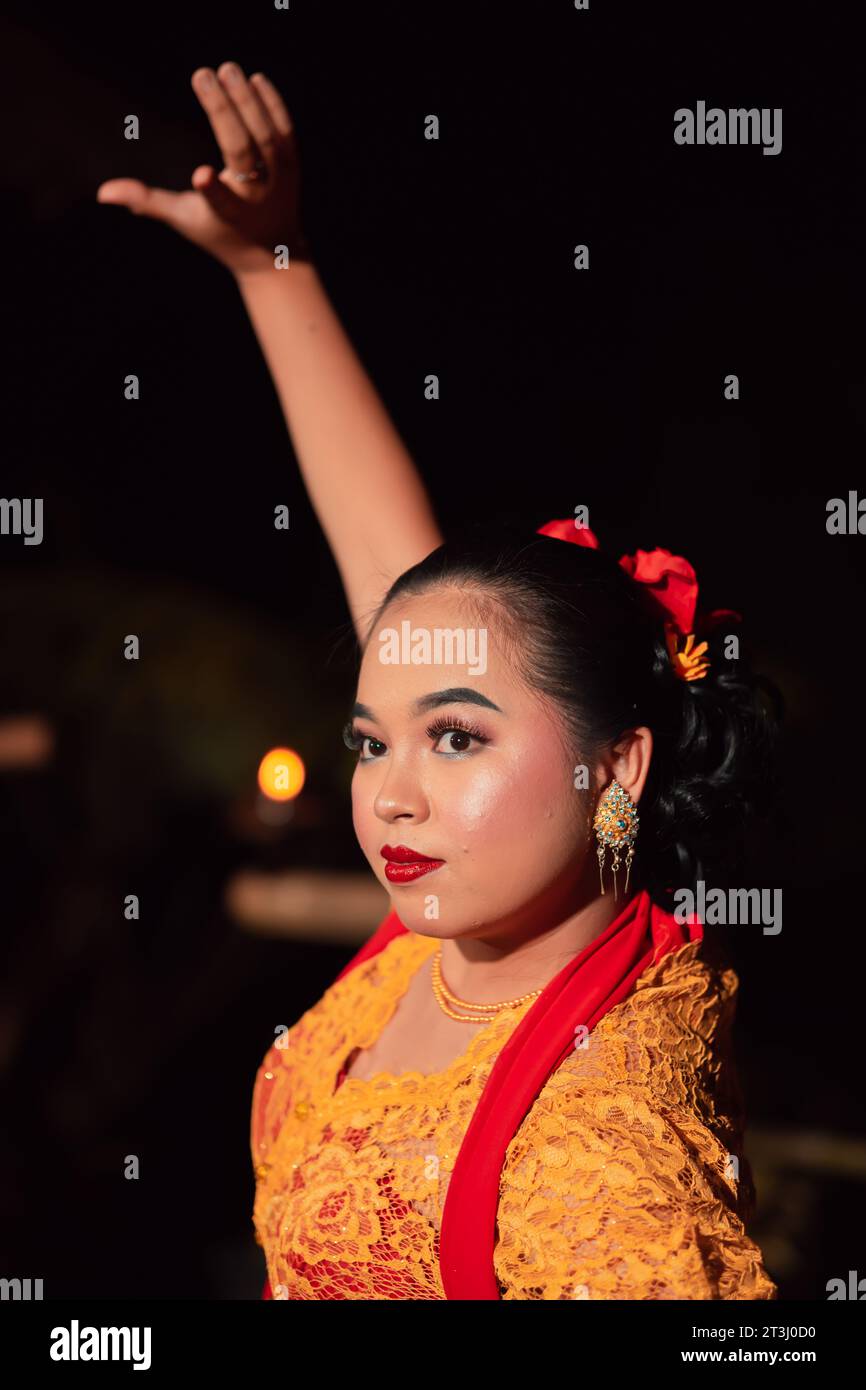 The beautiful closeup face of a Javanese woman with make-up at a ...