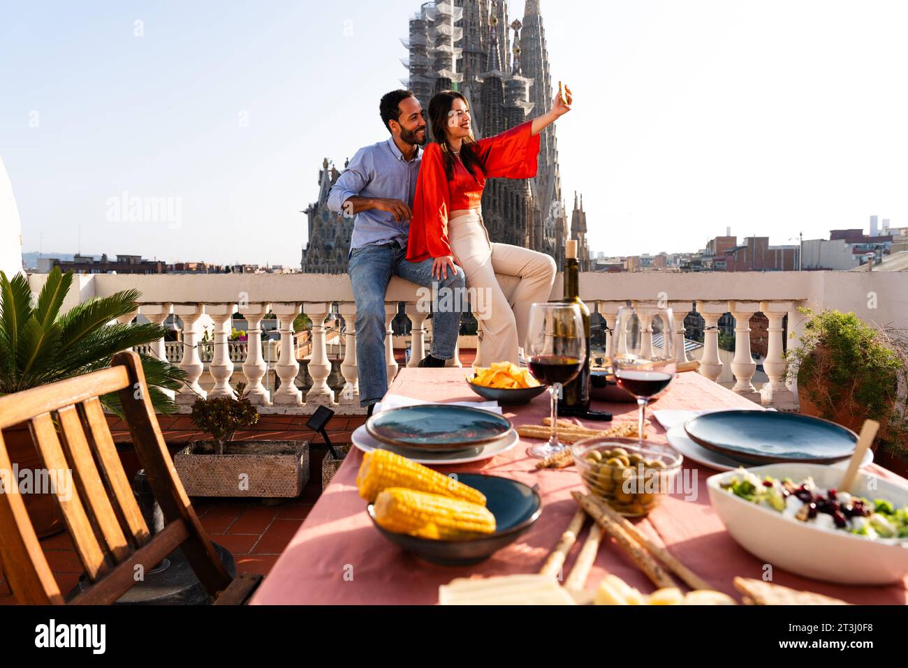Multiracial beautiful happy couple of lovers dating on rooftop balcony ...