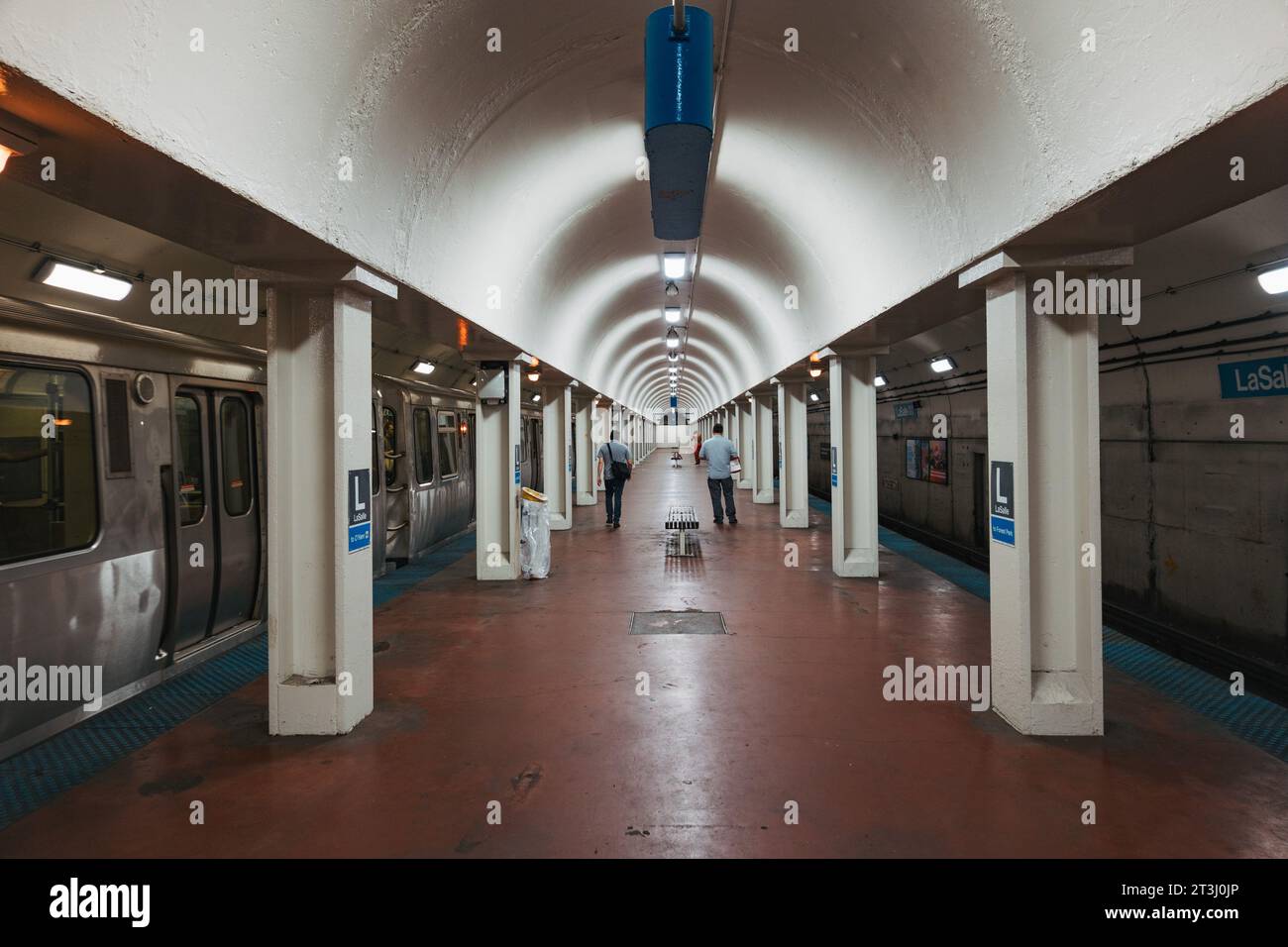 a train arrives to the platform at LaSalle Street Station in Chicago ...