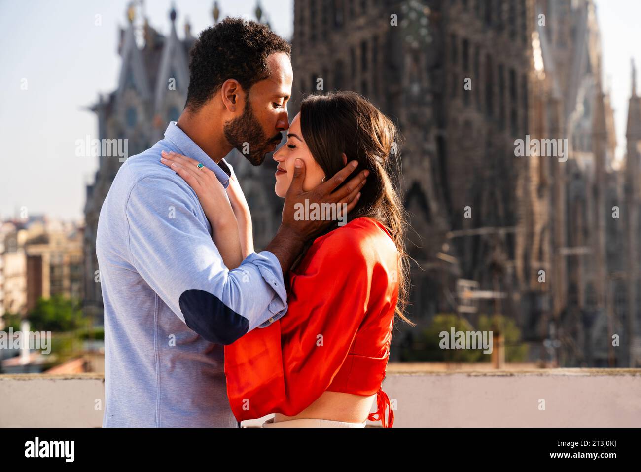 Multiracial beautiful happy couple of lovers dating on rooftop balcony ...