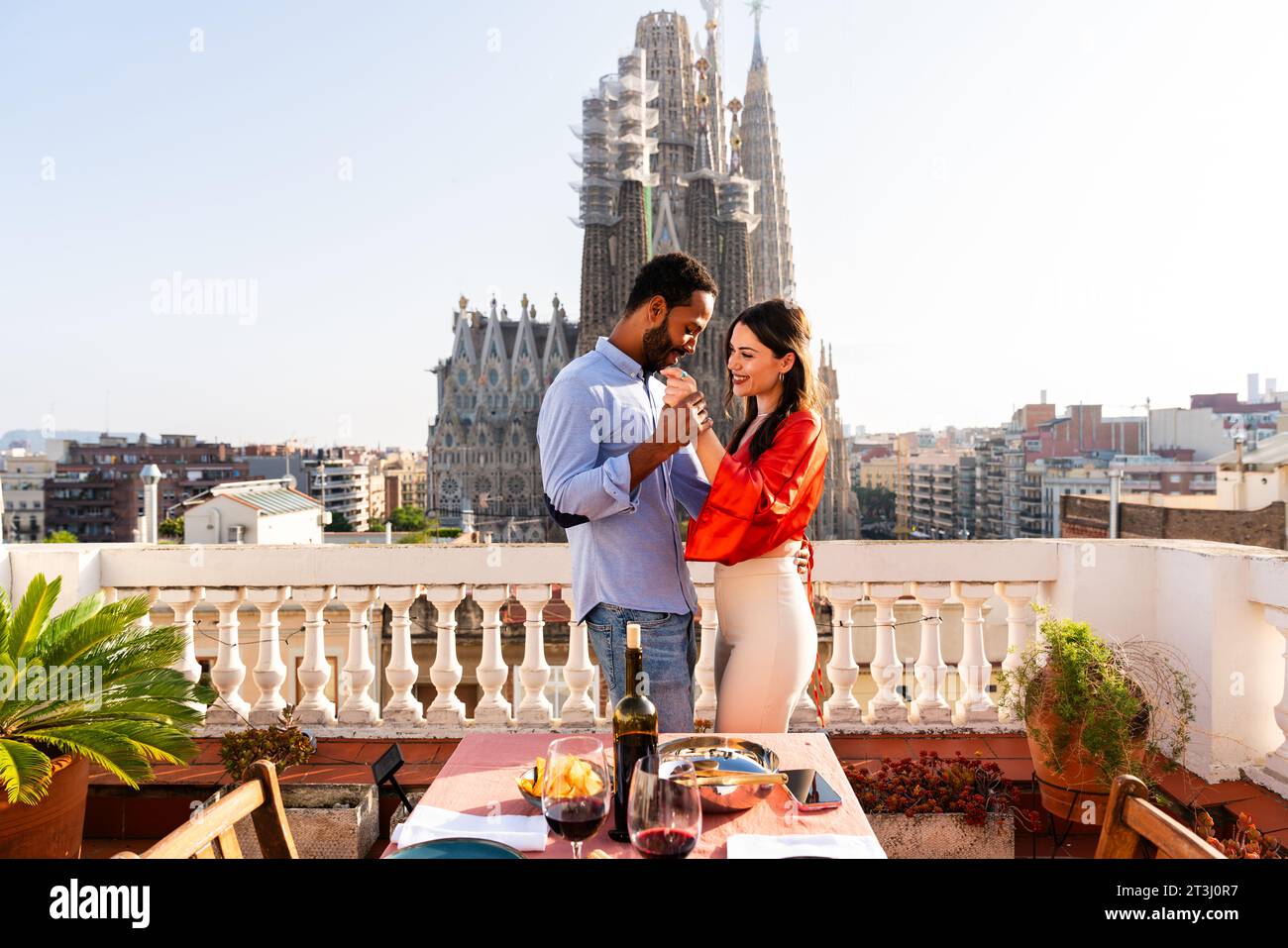 Multiracial beautiful happy couple of lovers dating on rooftop balcony ...