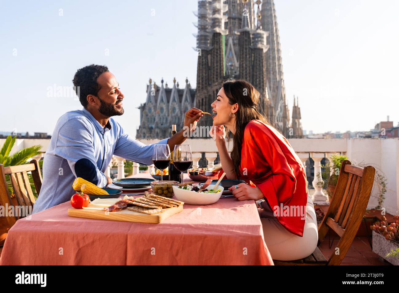 Multiracial beautiful happy couple of lovers dating on rooftop balcony ...