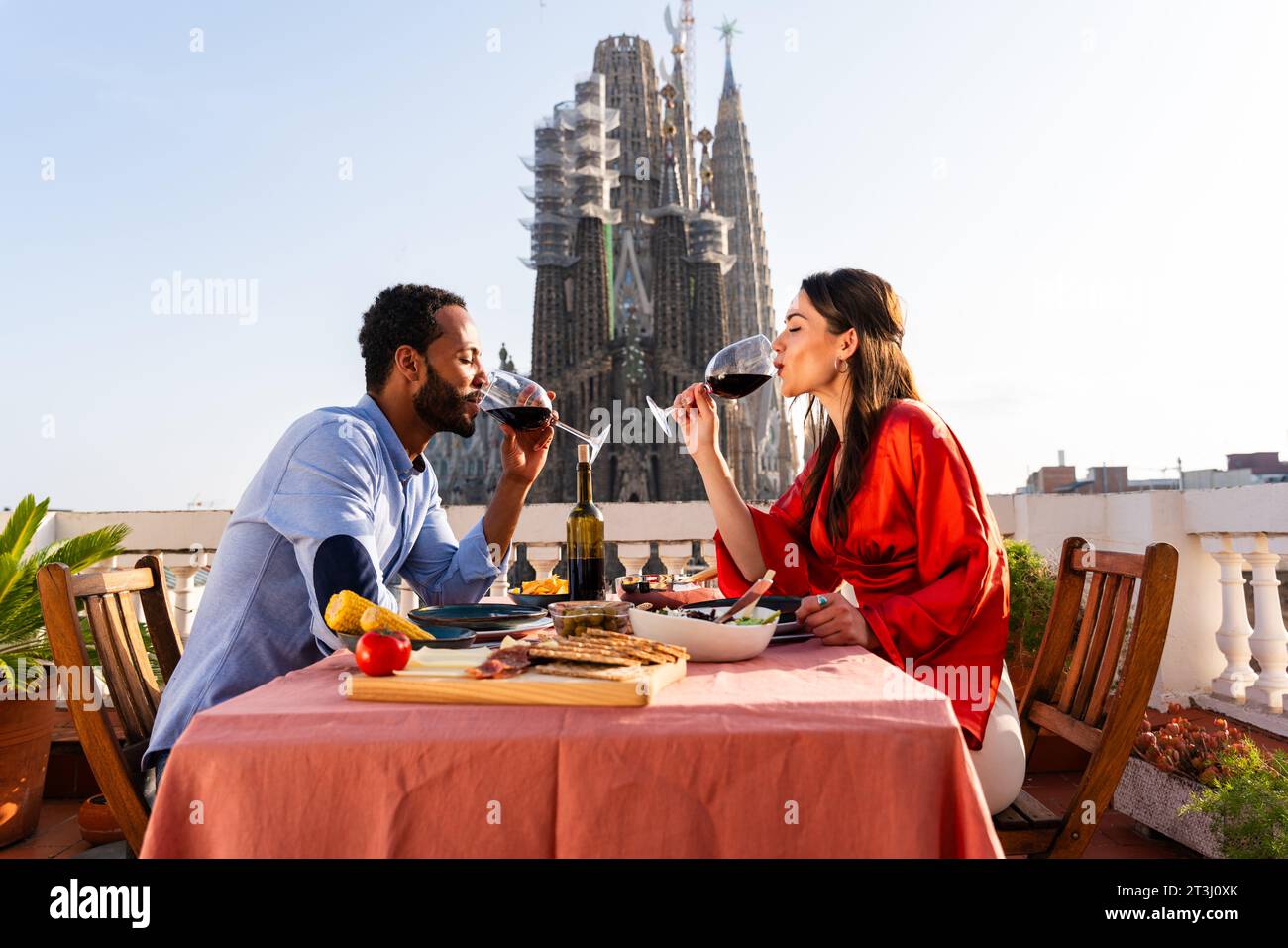 Multiracial beautiful happy couple of lovers dating on rooftop balcony ...