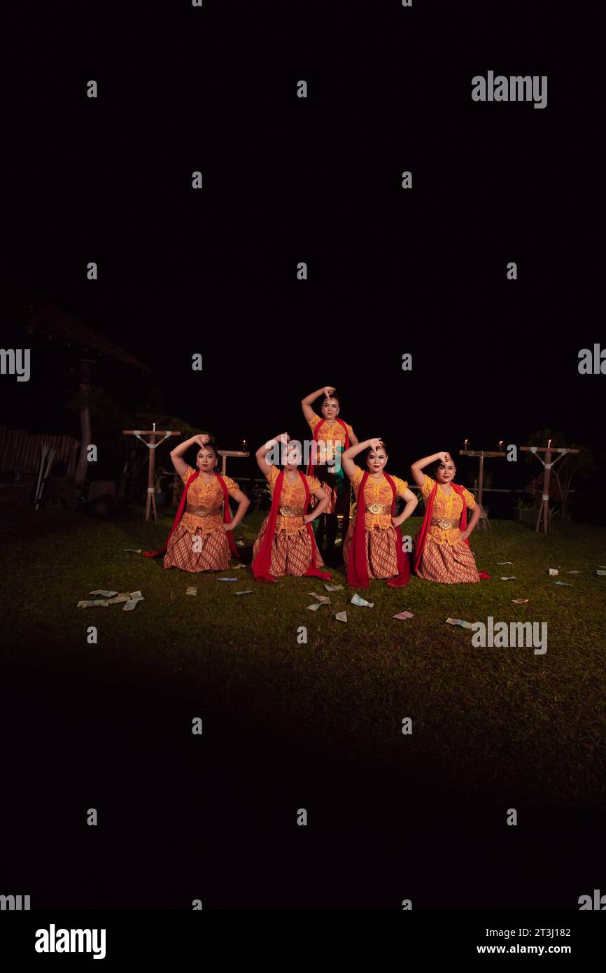 Asian dancers take pose with dance movements while performing the ...