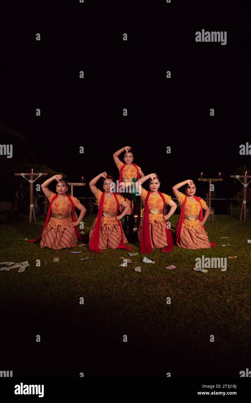 Asian dancers take pose with dance movements while performing the ...