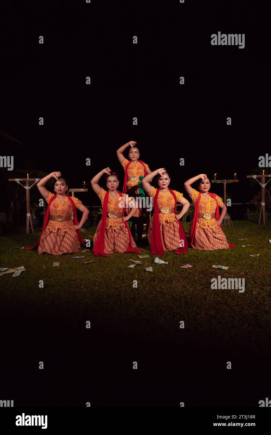 Asian dancers take pose with dance movements while performing the ...