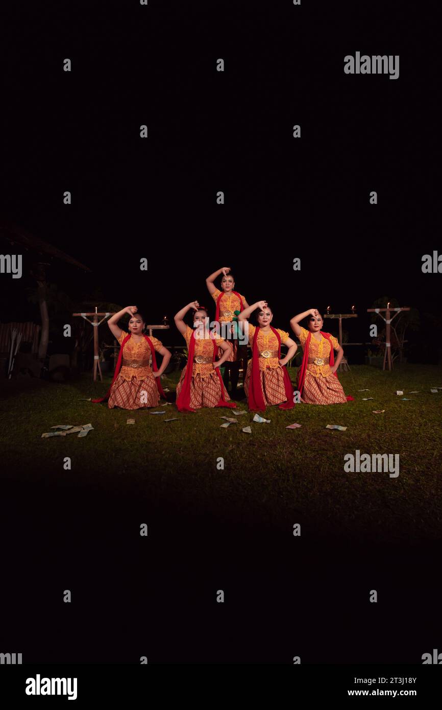 Asian dancers take pose with dance movements while performing the ...