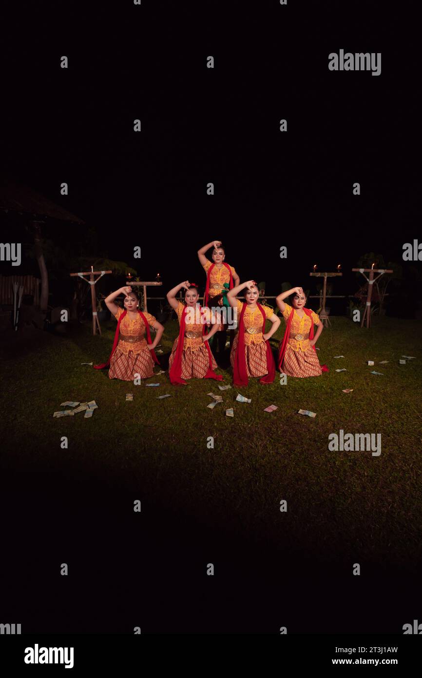 Asian dancers take pose with dance movements while performing the ...