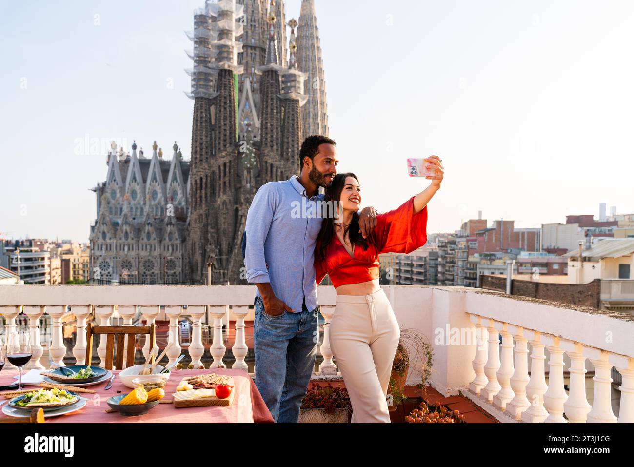 Multiracial beautiful happy couple of lovers dating on rooftop balcony ...