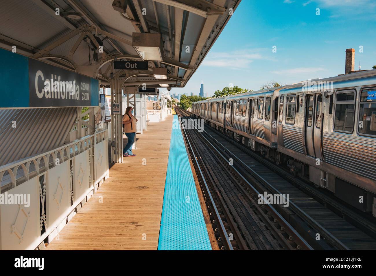 a train on Chicago's Blue Line elevated metro pulls in at California ...