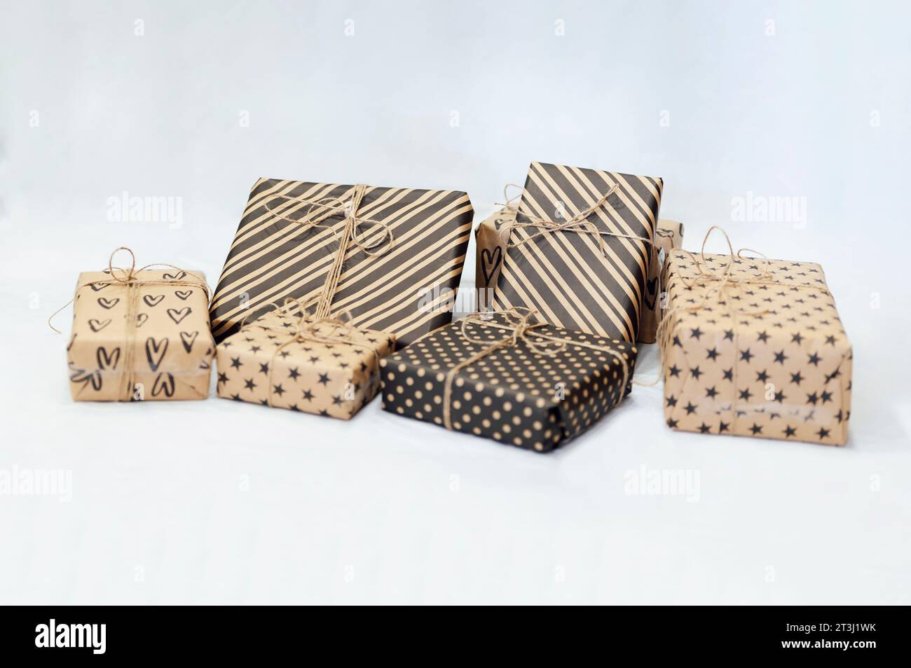 Gifts in eco-friendly paper packaging on a white background. Concept ...